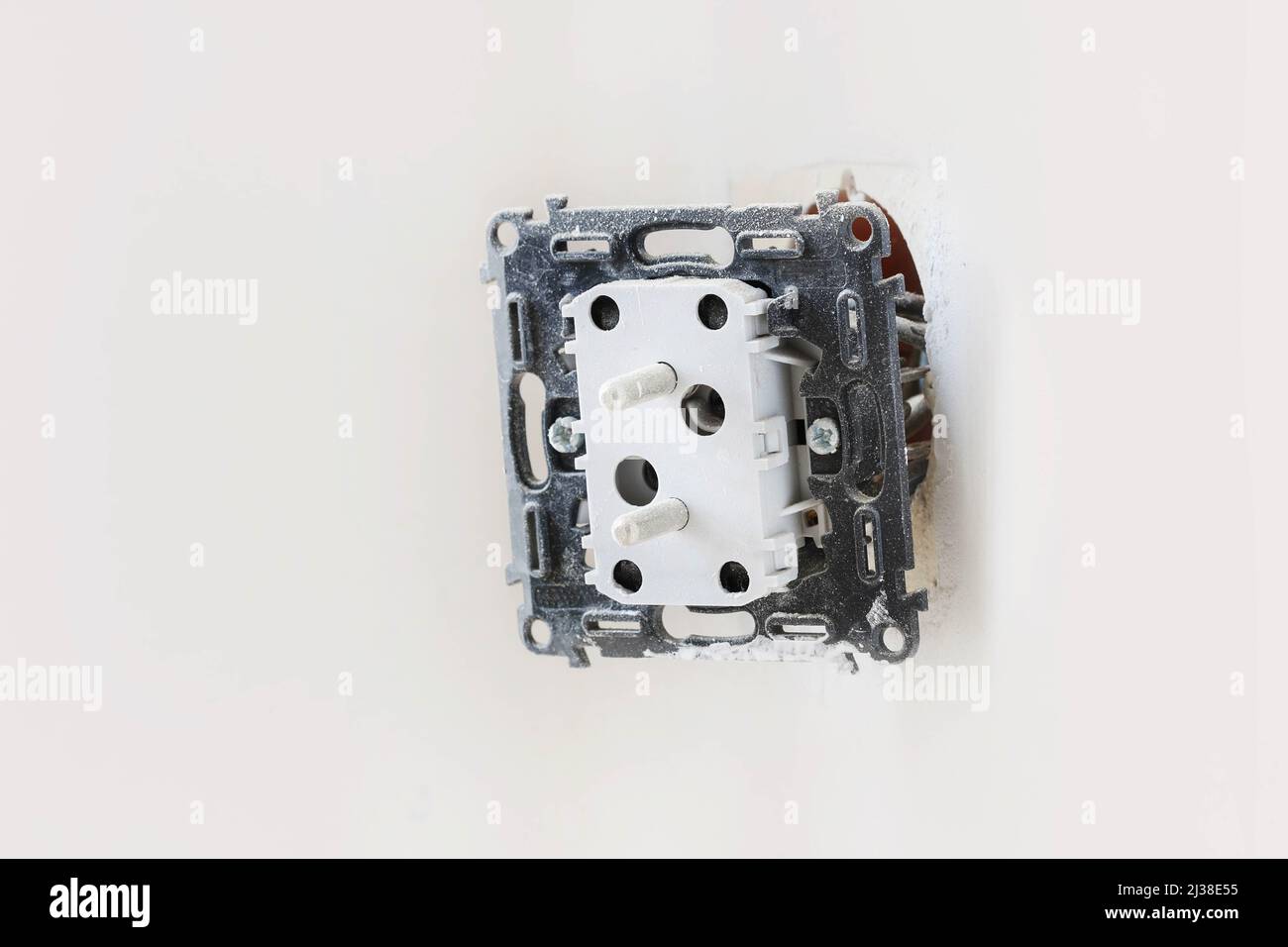 AC power plug during the instalation on the wall. Repair time Stock ...