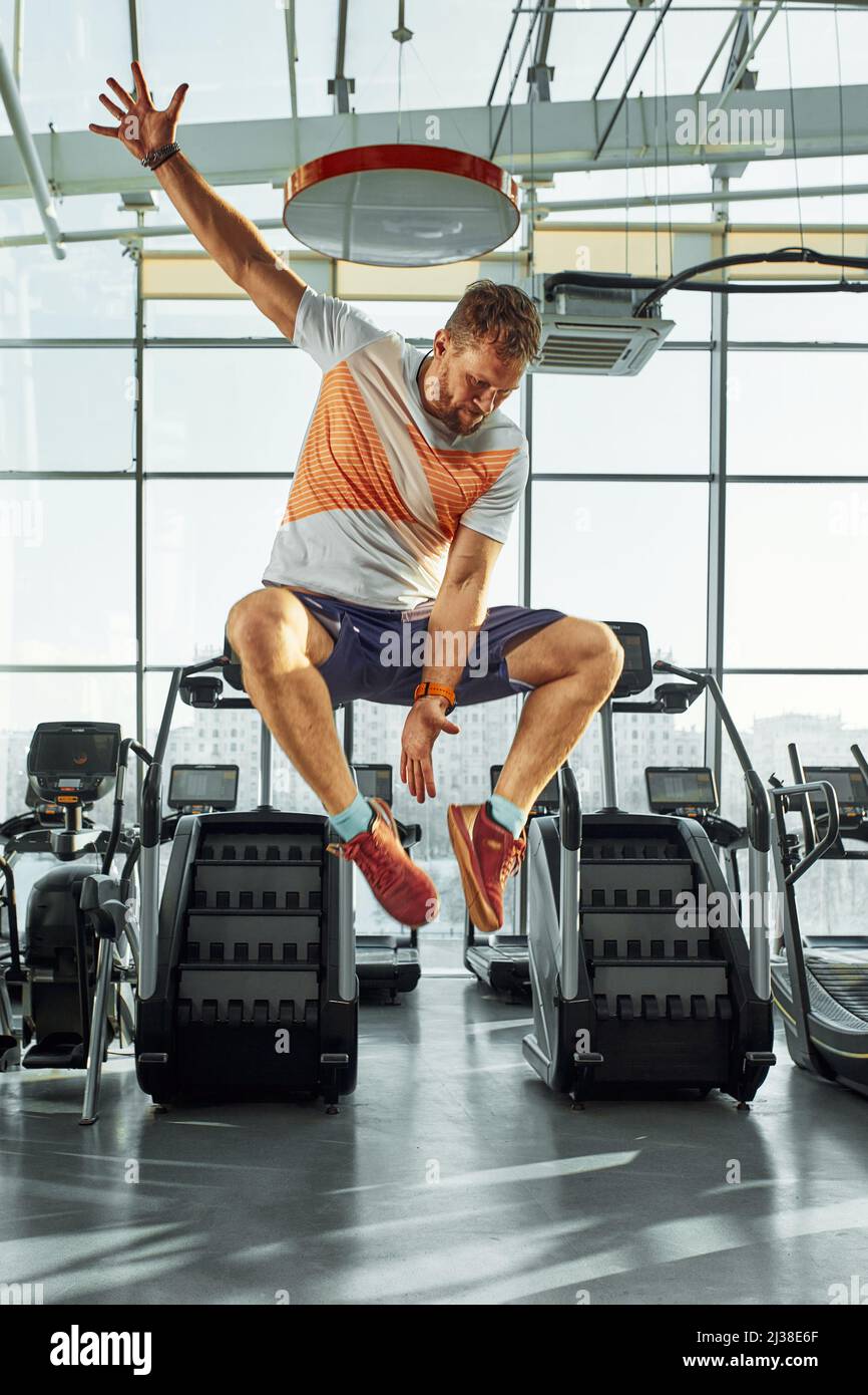 Handsome muscular men works out on functional training soft platform in ...