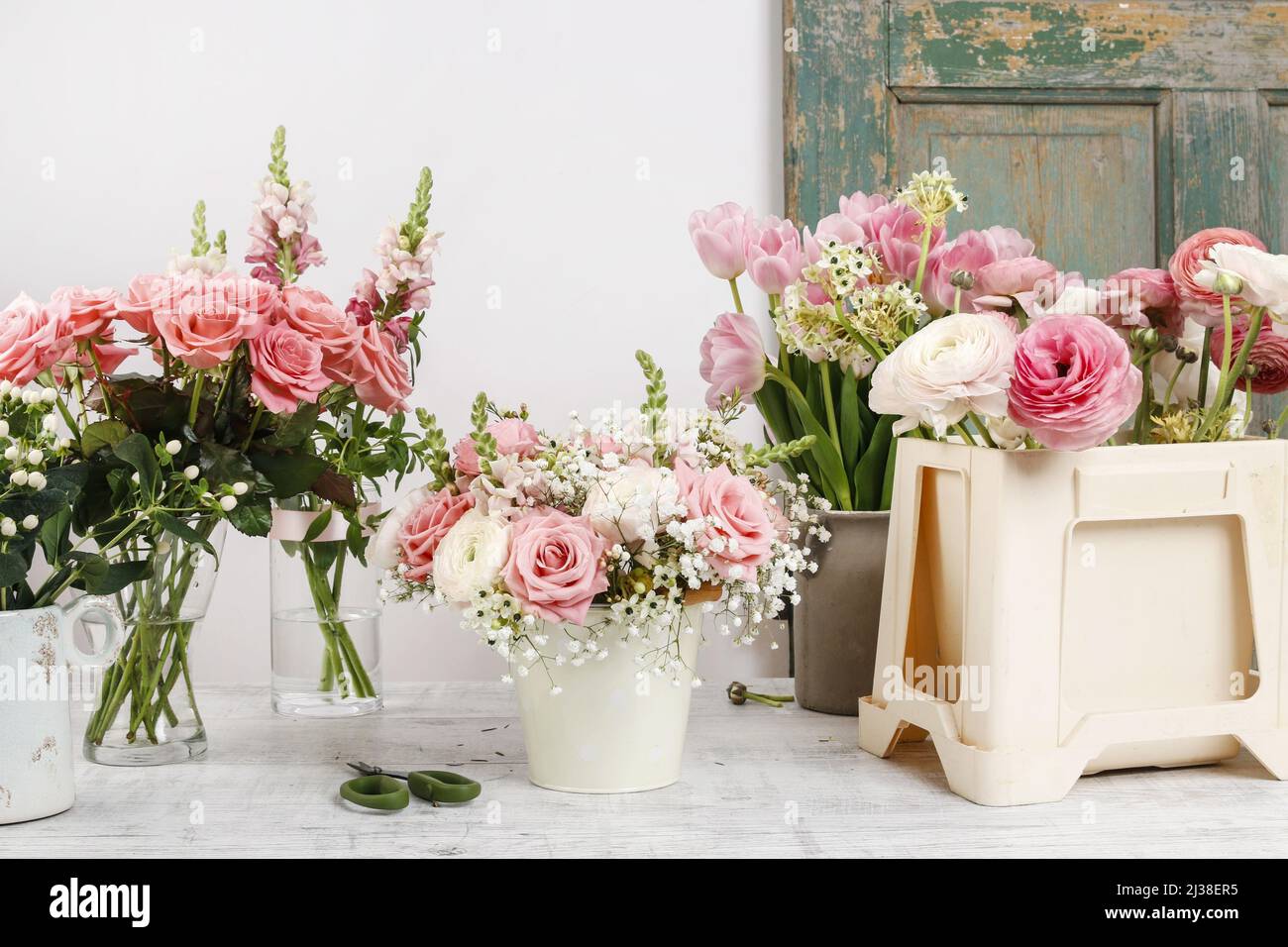 Bouquet of flowers and florist's accessories. Garden hobby Stock Photo ...