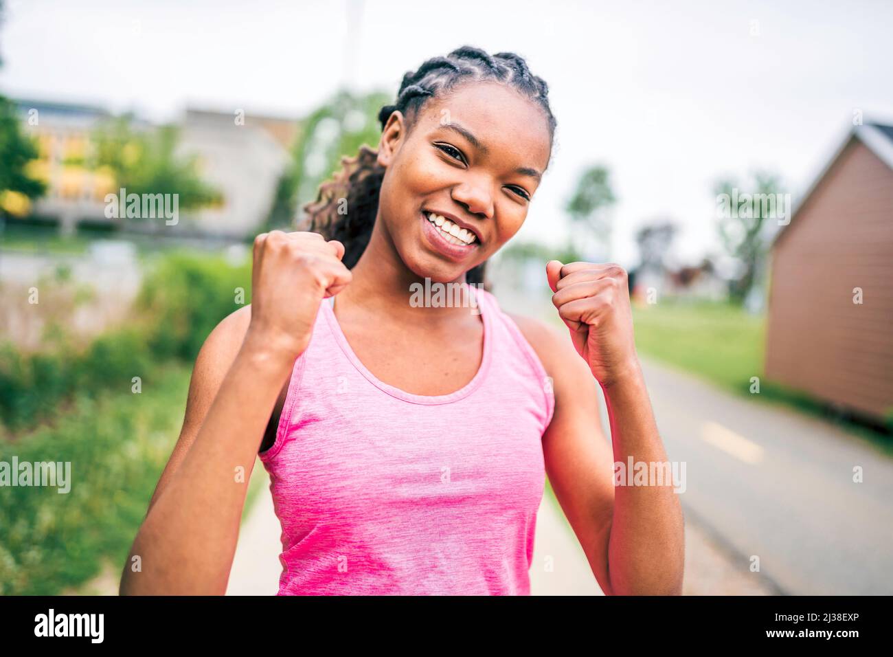 Woman runner in action outside in tree background Stock Photo - Alamy