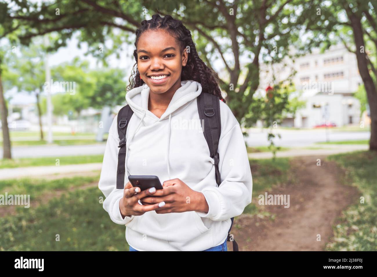 cute black teenager university student on campus with backpack Stock ...