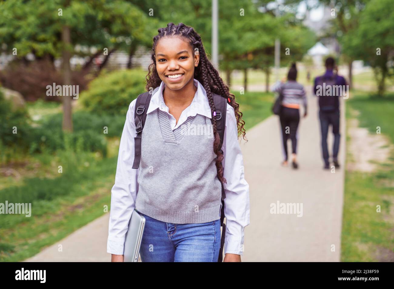 cute black teenager university student on campus with backpack Stock ...