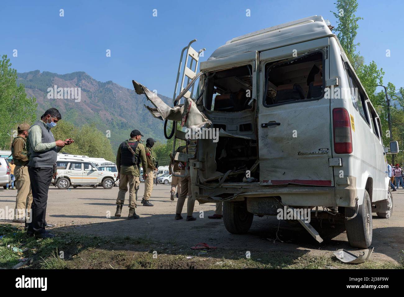 Indian forces stand guard near partially damaged tempo vehicle ...