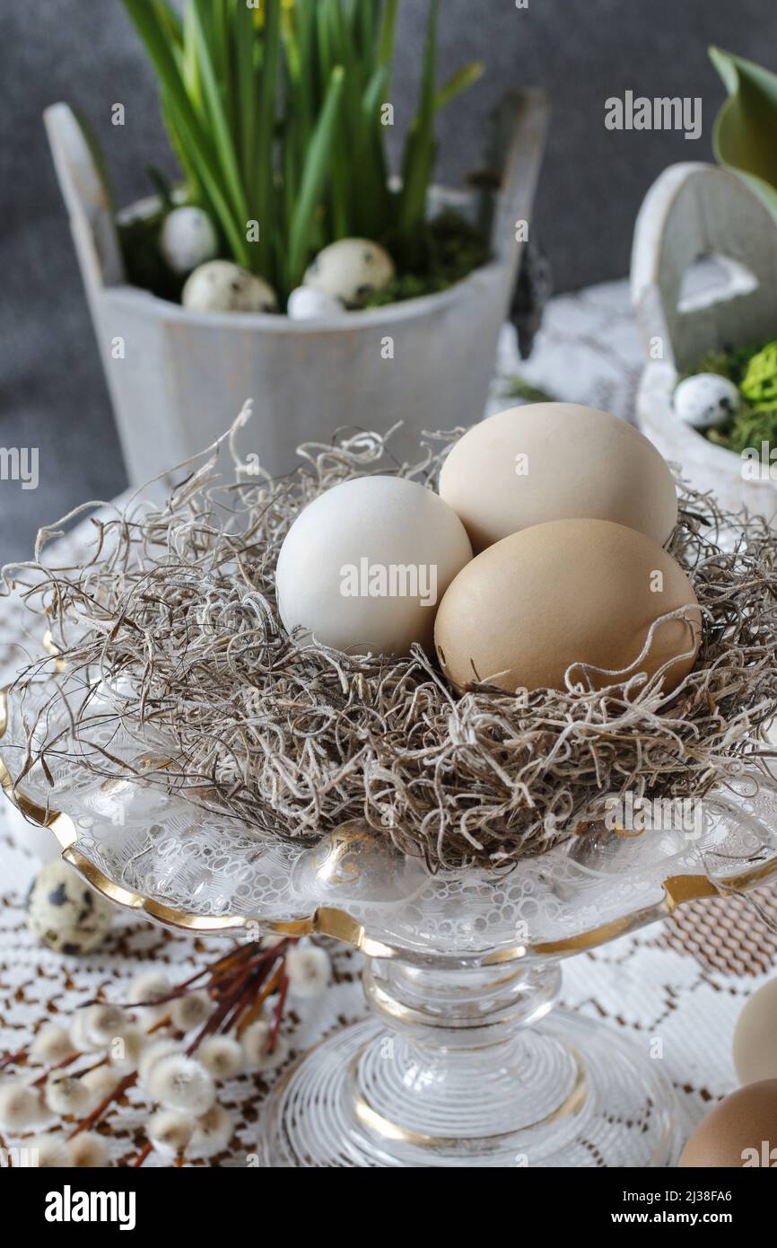 Sophisticated Easter decoration with eggs on crystal stand. Festive ...