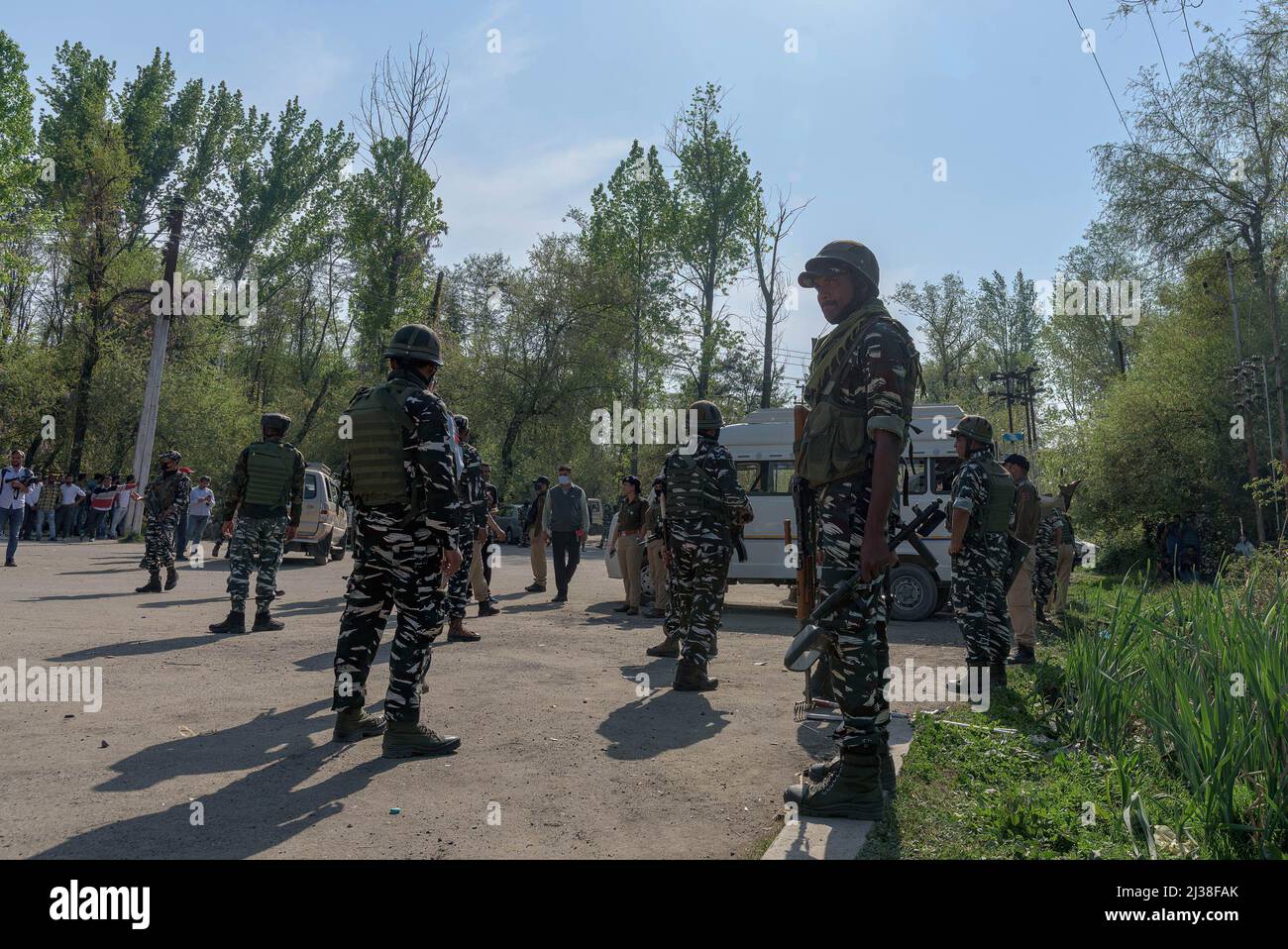 Indian forces stand guard near partially damaged tempo vehicle ...