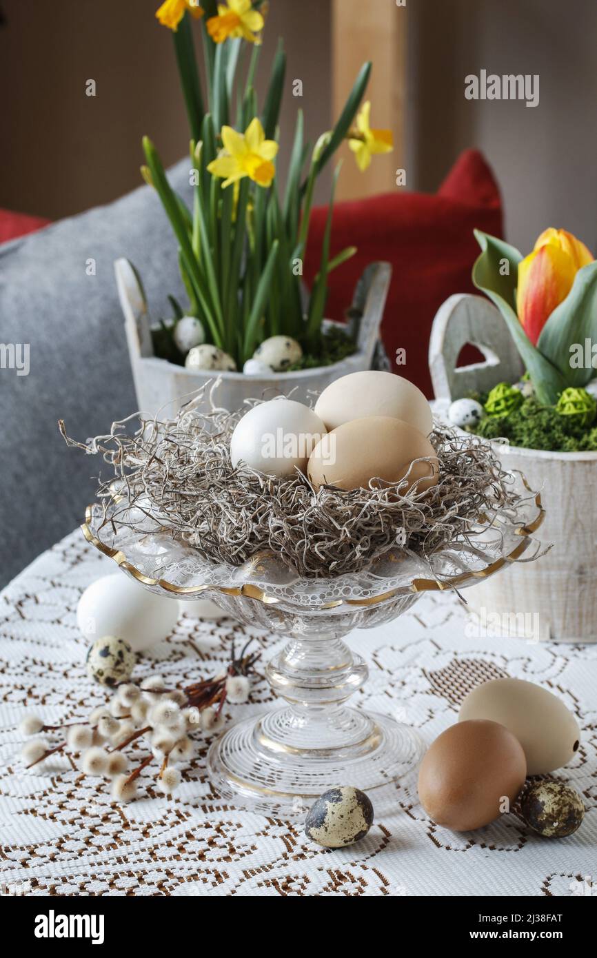 Sophisticated Easter decoration with eggs on crystal stand. Festive ...