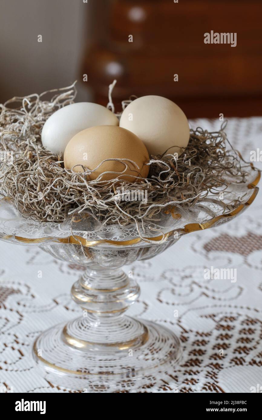Sophisticated Easter decoration with eggs on crystal stand. Festive ...