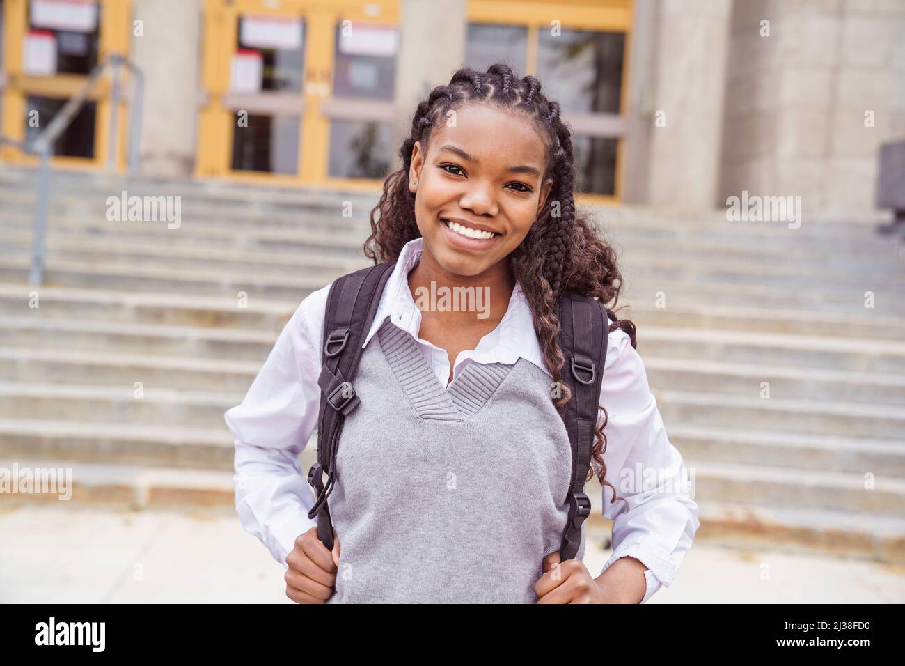 cute black teenager university student on campus with backpack Stock ...