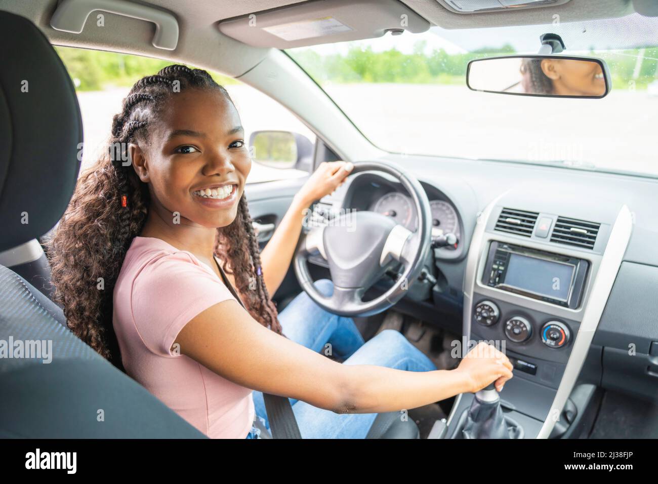 Happy black woman in car hi-res stock photography and images - Alamy