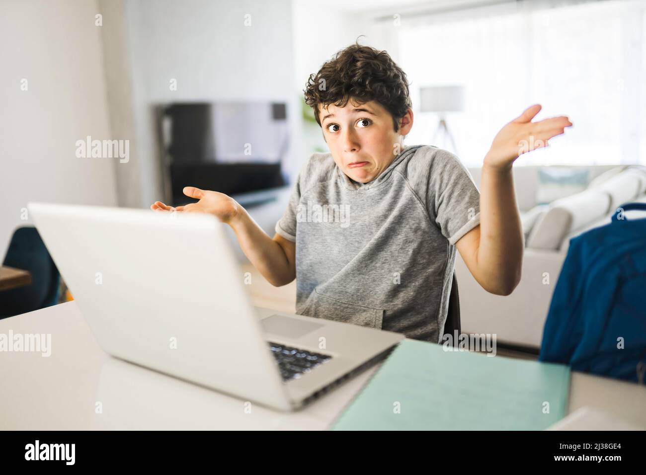 bored and sad teen student after hard work with computer Stock Photo ...