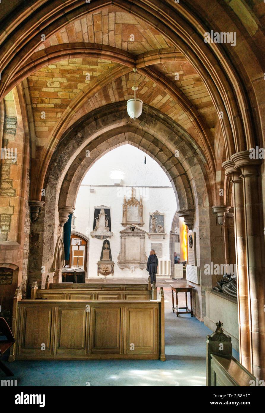Looking through the vibrantly lit stone arches of the eastern side isle ...
