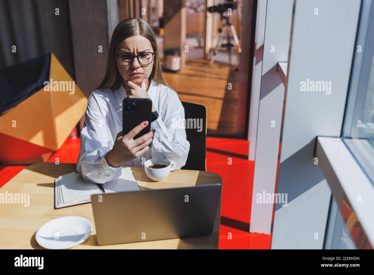 Businesswoman manager in a white shirt doing office work and smiling ...