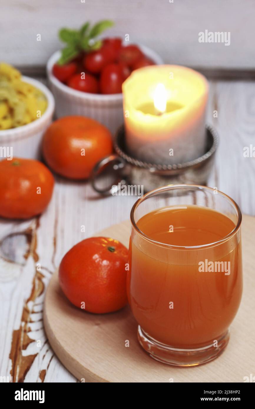 Glass of orange juice and a fresh fruits on the table. Healthy food ...
