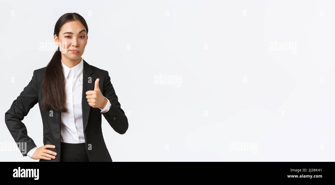 Pleased female entrepreneur, lady boss in black suit satisfied with ...