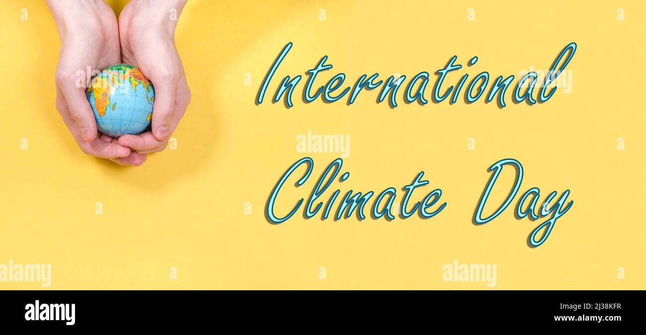 The inscription international climate day on a yellow background with ...
