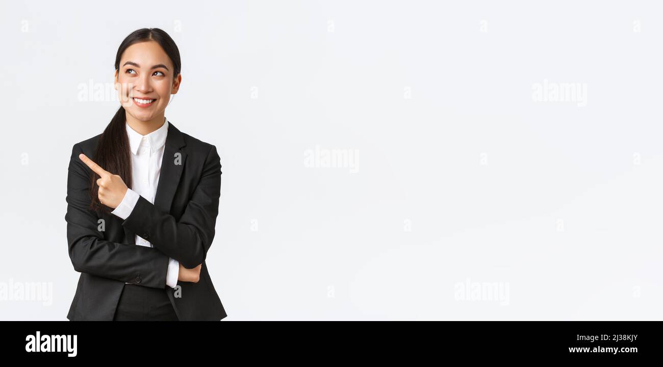 Successful upbeat smiling asian female manager, businesswoman in suit ...