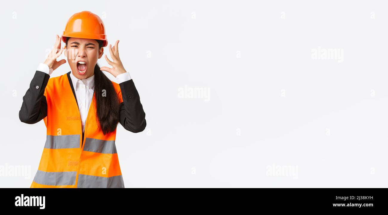Mad and outraged asian female chief engineer, construction manager ...
