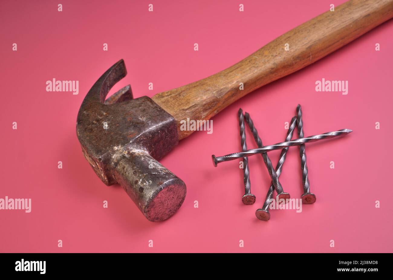 High Angle View of Hammer and Nails Isolated on a Pink Background Stock ...