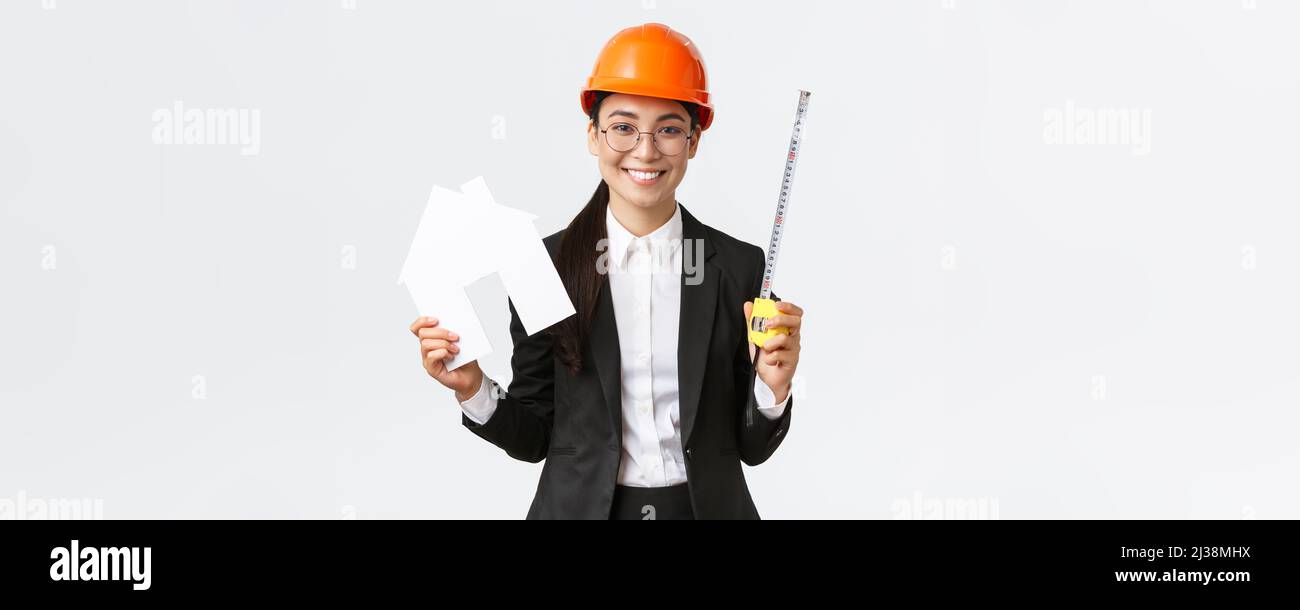 Smiling professional female asian engineer, architect in helmet and ...