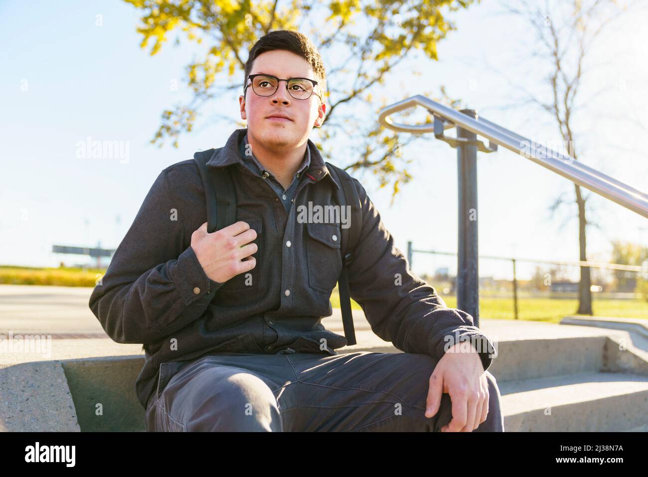 Nice Student with backpack outside university school Stock Photo - Alamy
