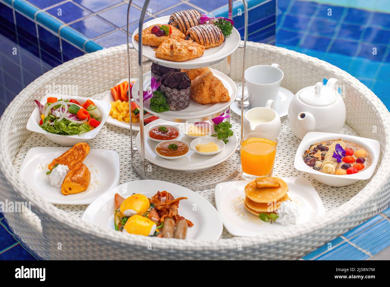 Floating breakfast in luxury hotel resort. Breakfast in swimming pool ...