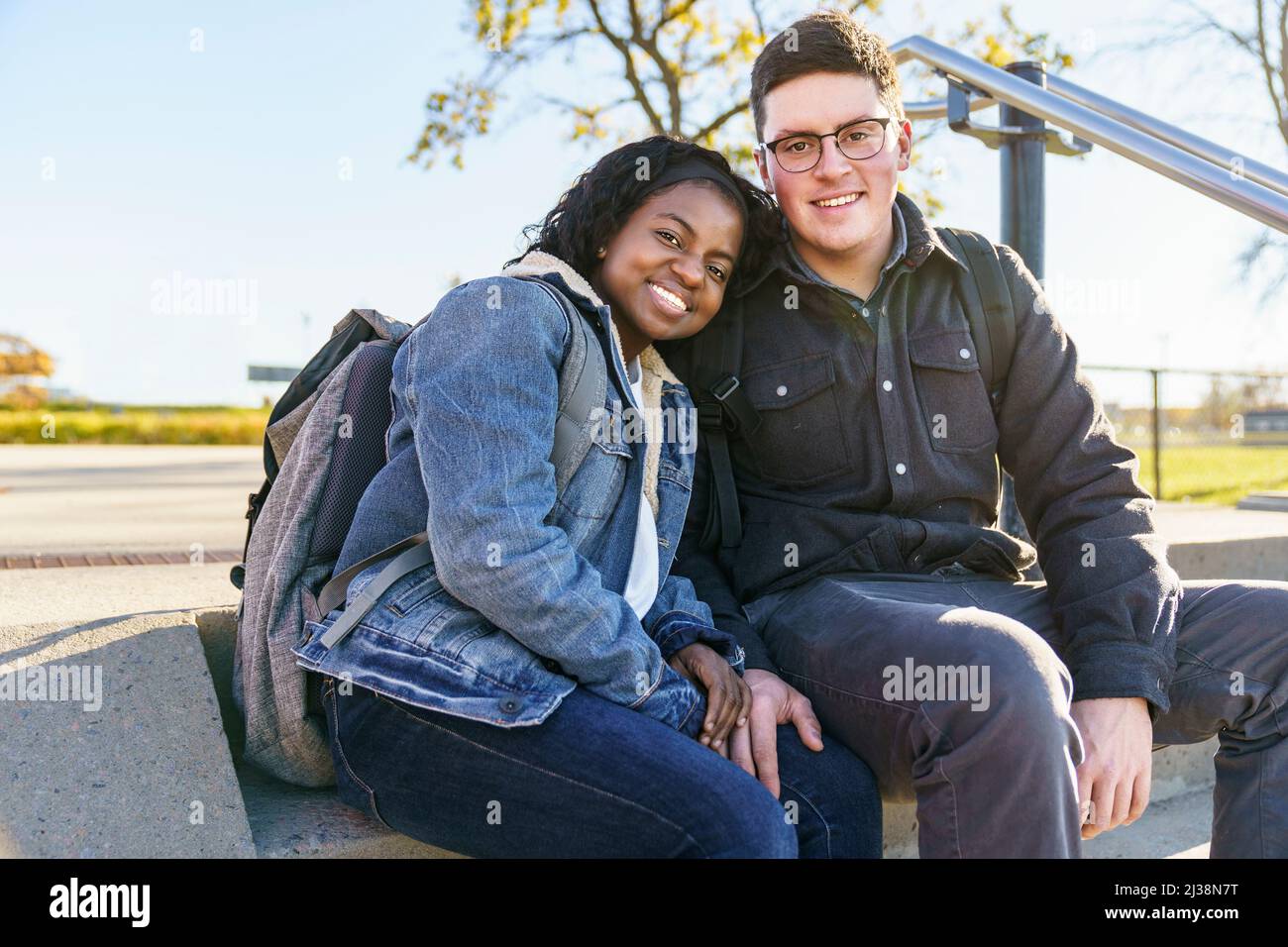 Couple of students at the university having good time Stock Photo - Alamy
