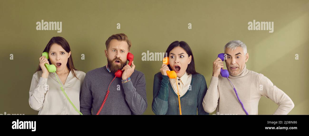 Portrait of group of people talking on landlines and having shocked and ...
