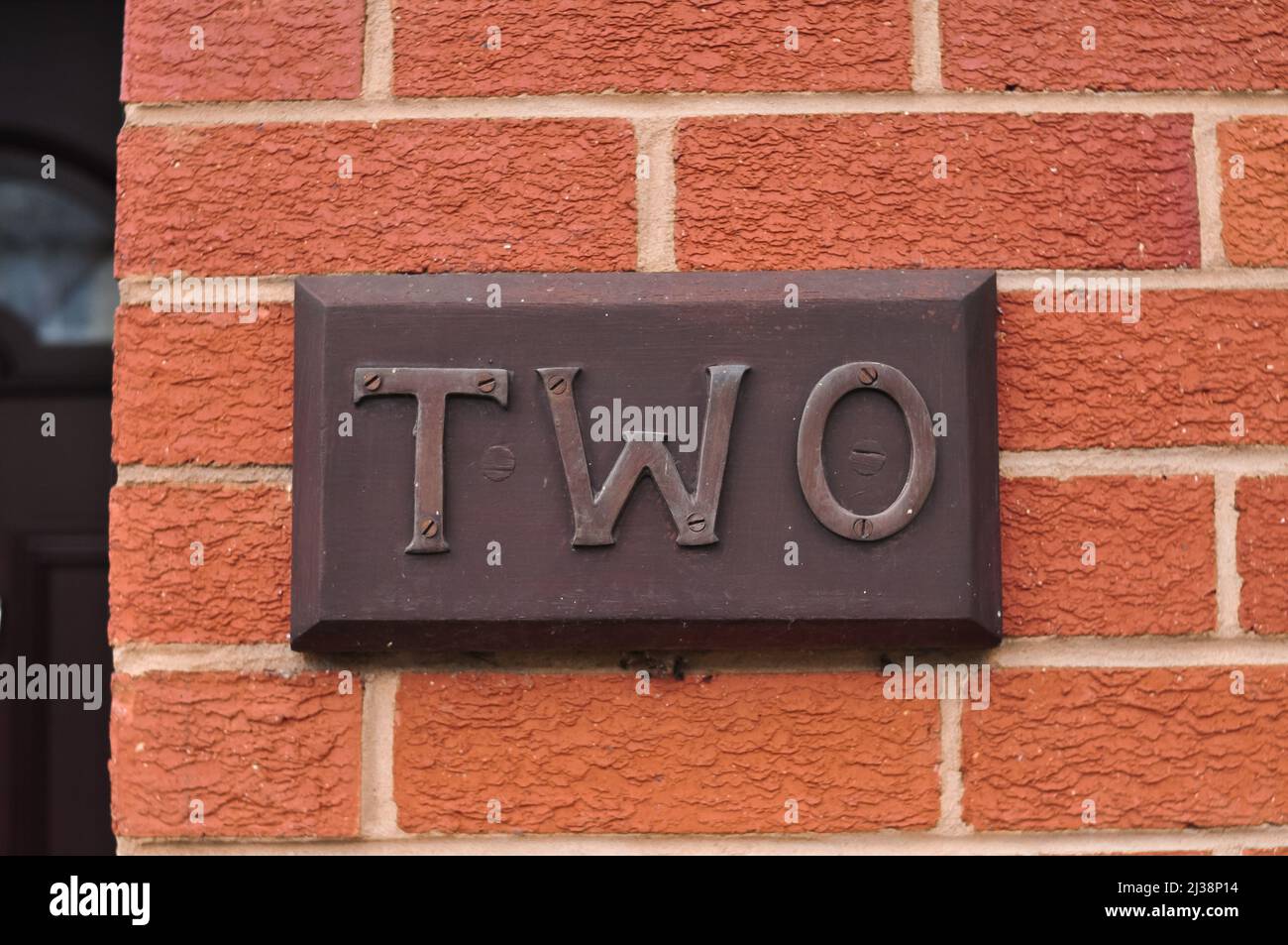The word two on the red brick wall background . High quality photo ...