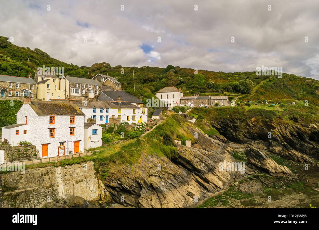 The houses of Portloe on top of the cliffs overlooking the harbour and ...