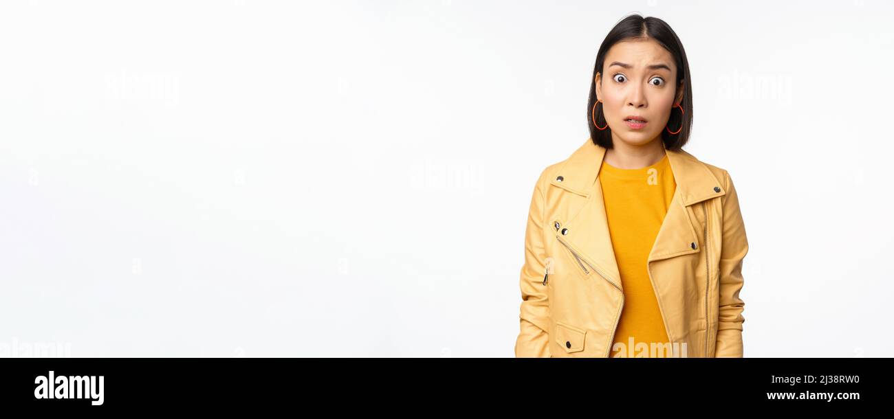 Image of shocked, confused asian woman, staring frustrated and ...