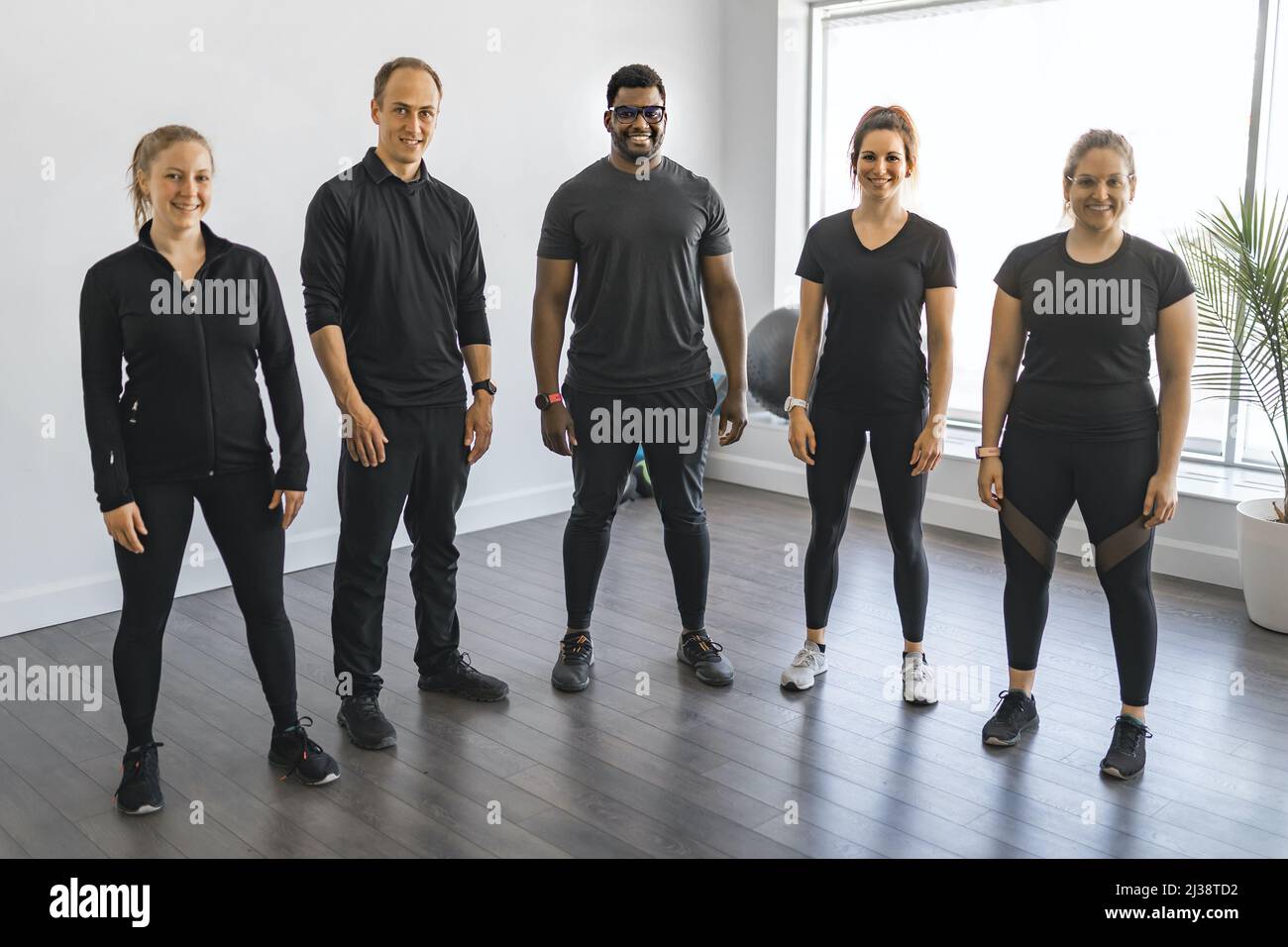 team of trainer standing with a smile in the training gym Stock Photo ...