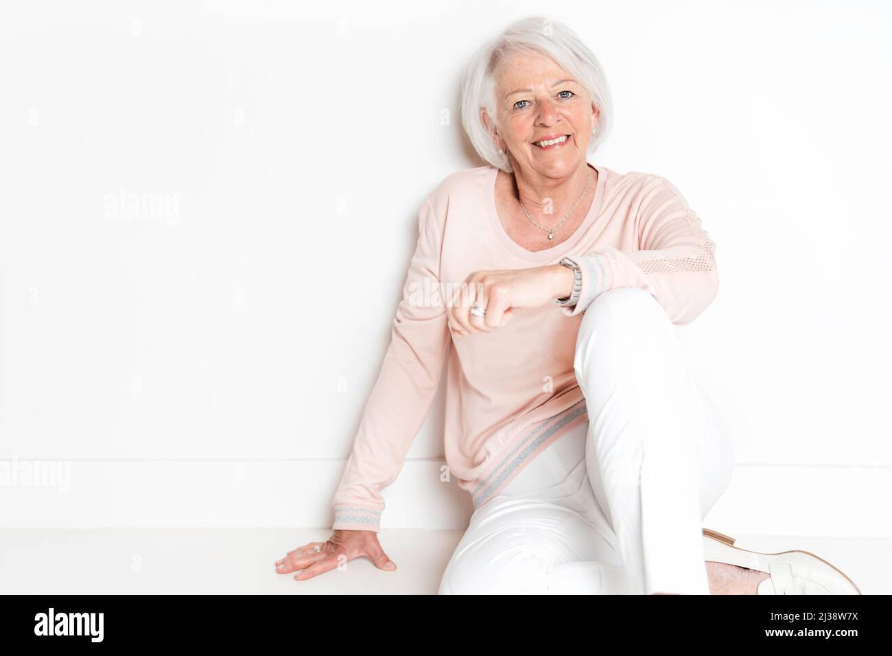 nice portrait of a retired senior woman on studio background Stock ...