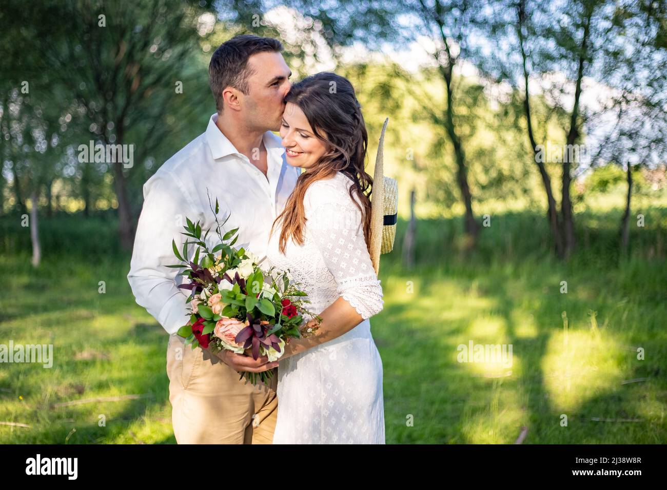 nice portrait of beautiful and young groom and bride outdoors Stock ...