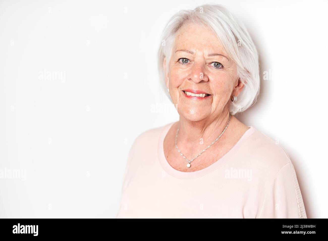 nice portrait of a retired senior woman on studio background Stock ...