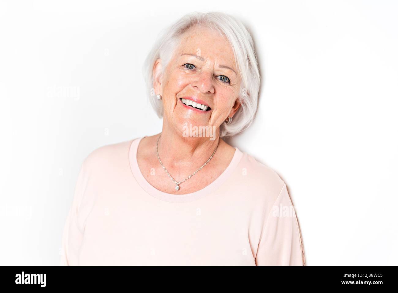 nice portrait of a retired senior woman on studio background Stock ...