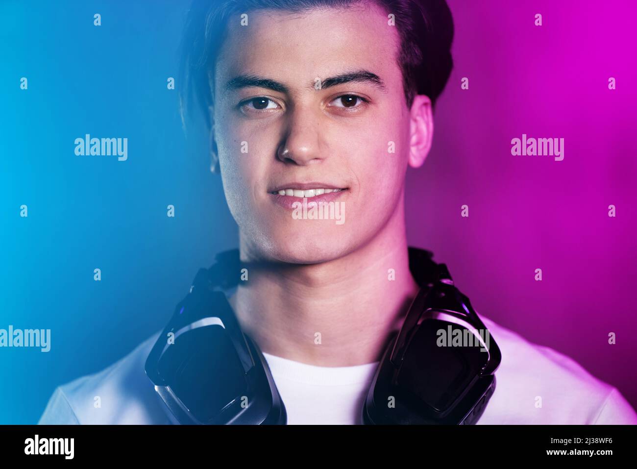 Its a gamers world and were all just connected to it. Portrait of a young man playing computer ...