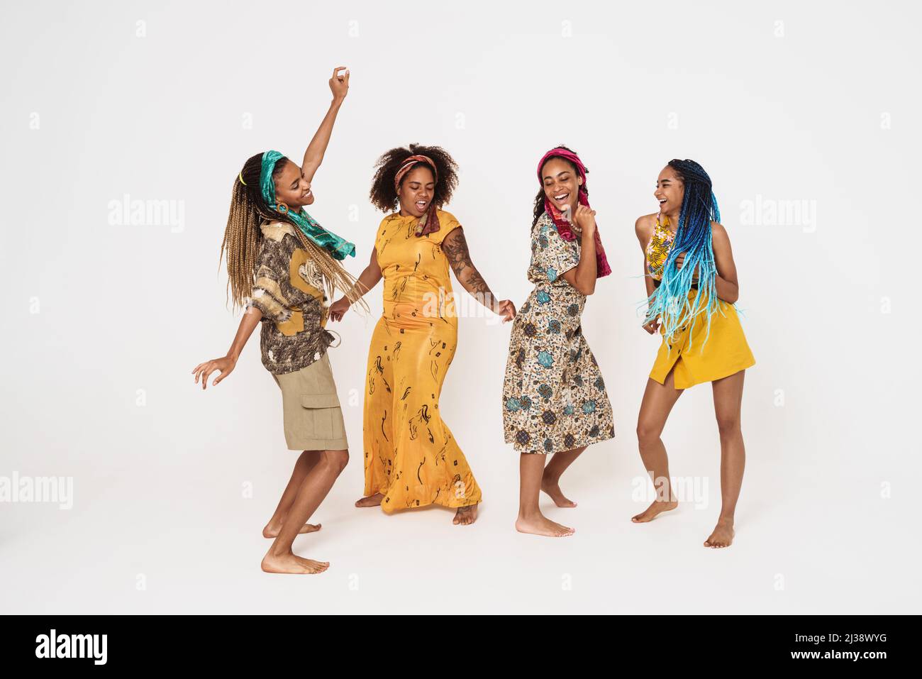 Young black four women wearing dress singing and dancing on camera ...