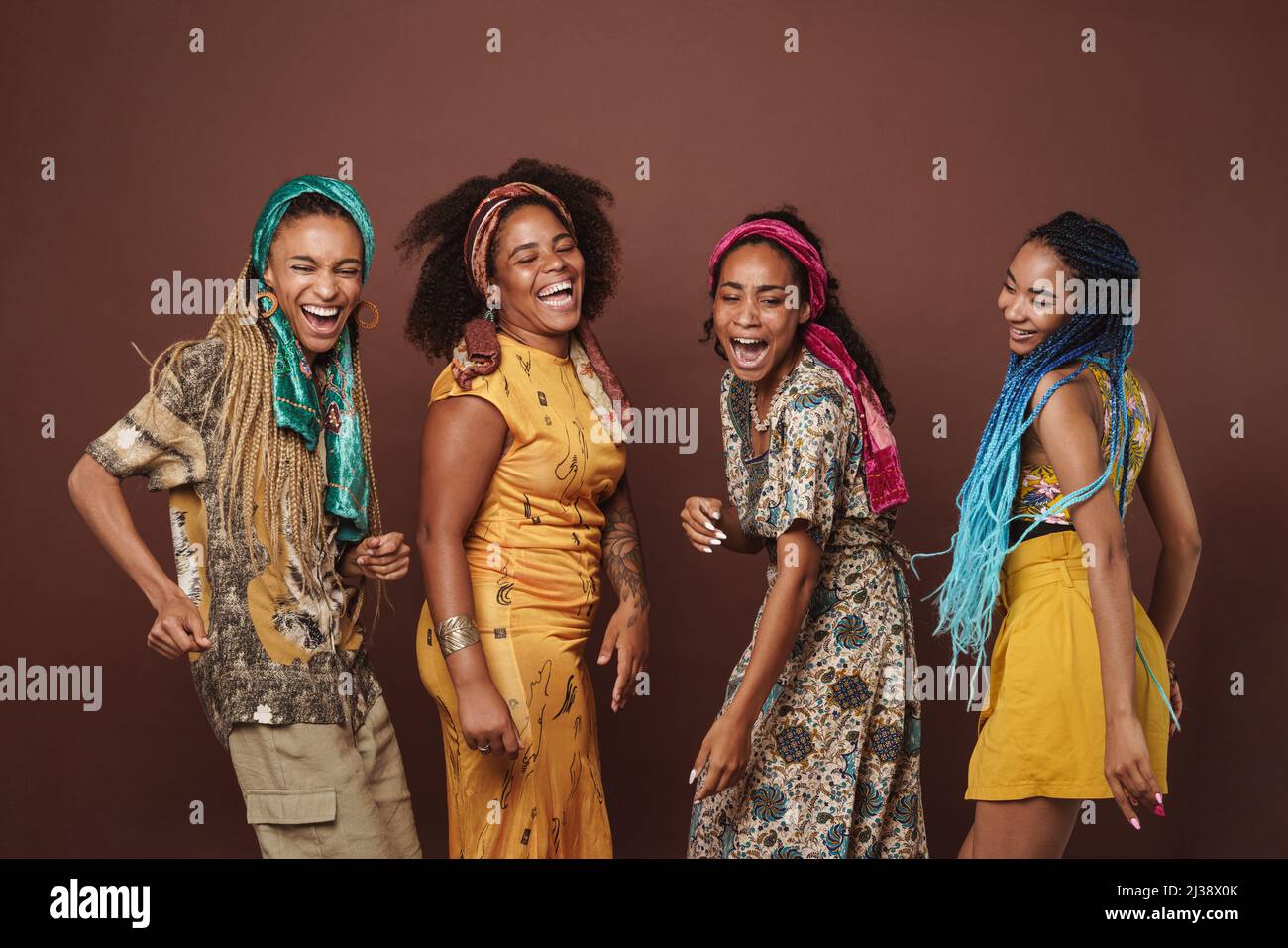 Young black four women wearing dress singing and dancing on camera ...