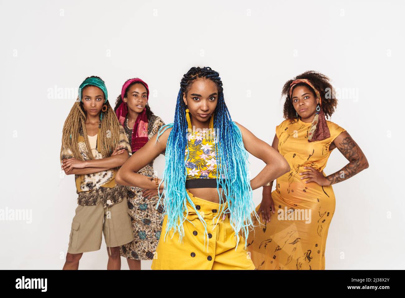 Young black four women wearing dress posing together on camera isolated ...