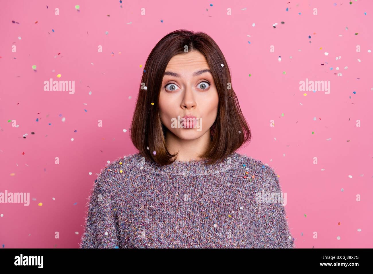 Portrait of attractive brown-haired funky girl flying confetti sending ...