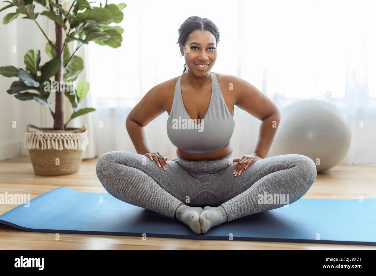 African american woman working out in home livingroom gym Stock Photo ...