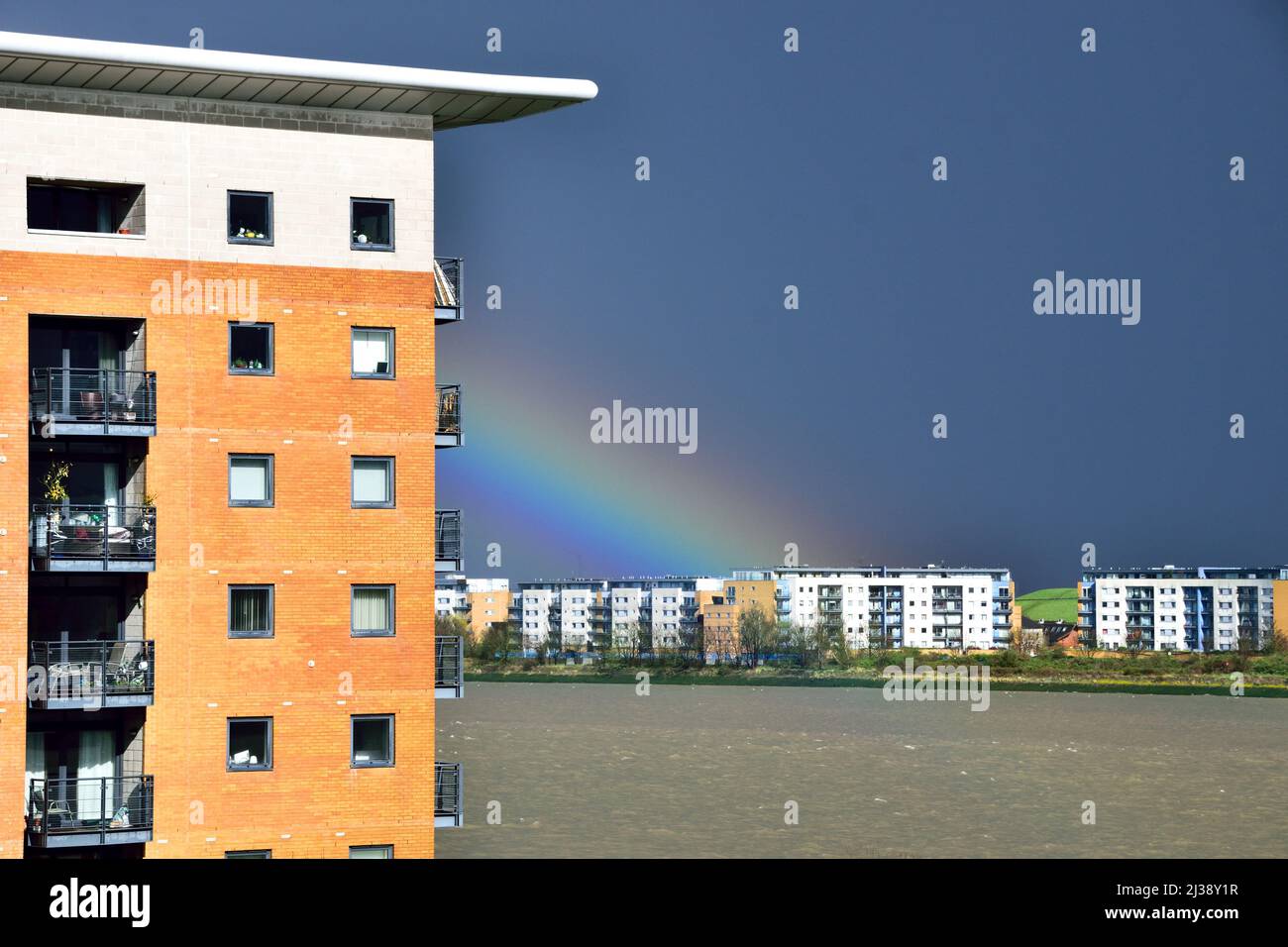 Rainbow and storm clouds over the River Thames in East London Stock ...