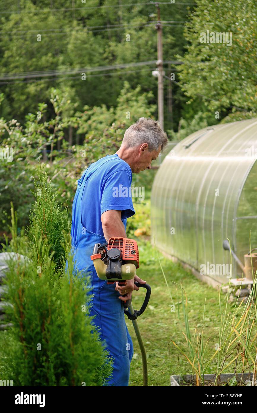 Manual hand grass cutter hi-res stock photography and images - Alamy