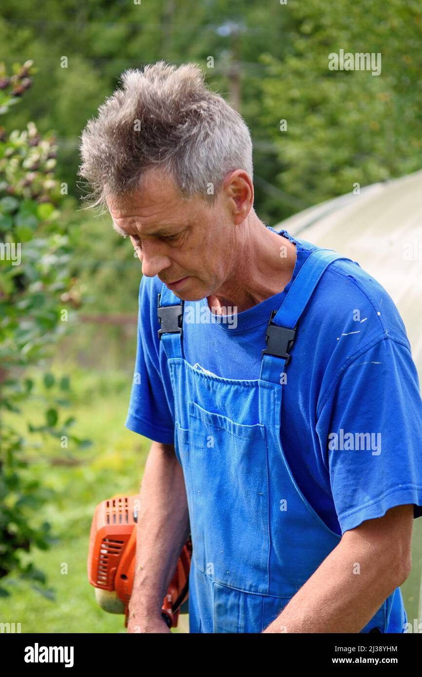 Manual hand grass cutter hi-res stock photography and images - Alamy