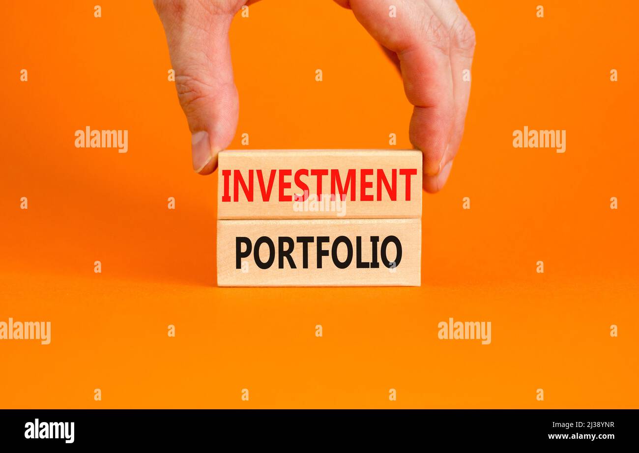 Investment portfolio symbol. Wooden blocks with concept words ...