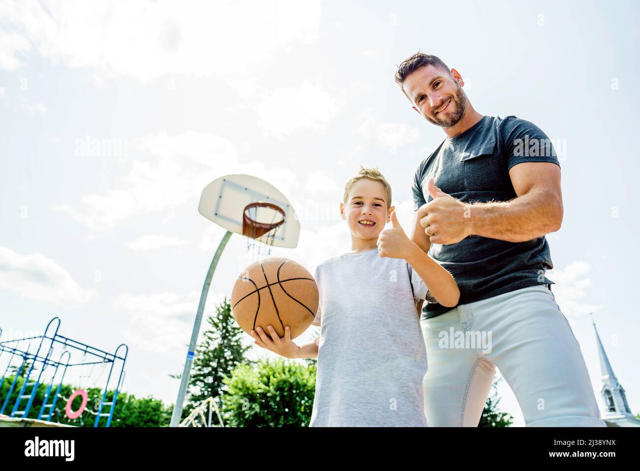 Happy basketball family portrait play this sport on summer season. The ...