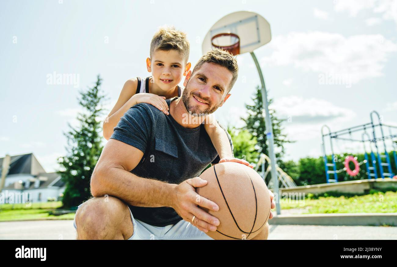 Happy basketball family portrait play this sport on summer season. The ...