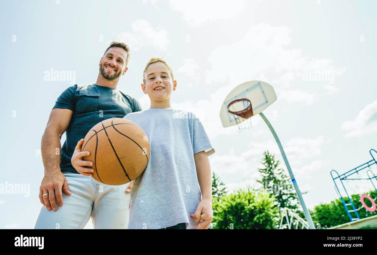 Happy basketball family portrait play this sport on summer season. The ...