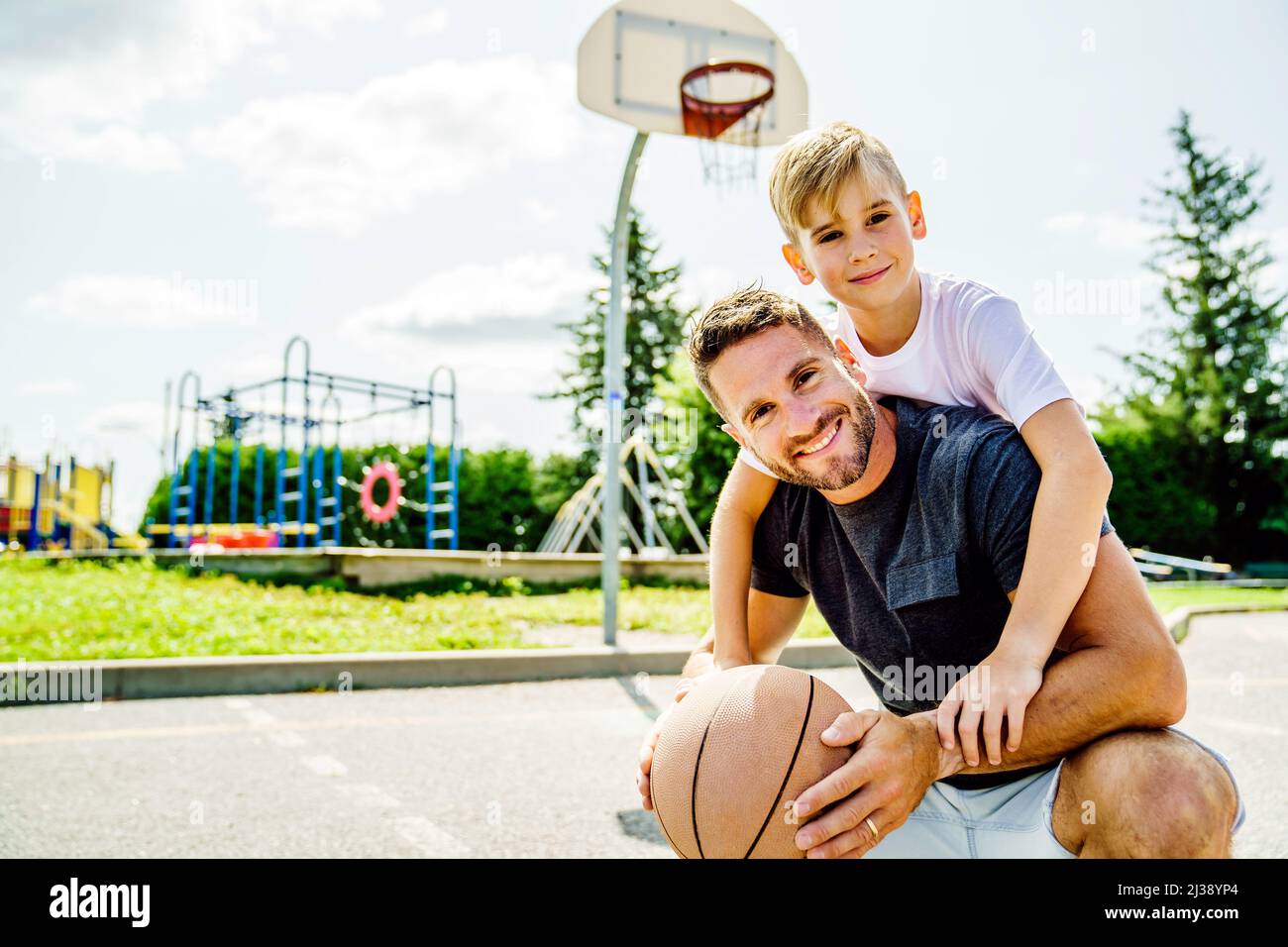 Happy basketball family portrait play this sport on summer season. The ...