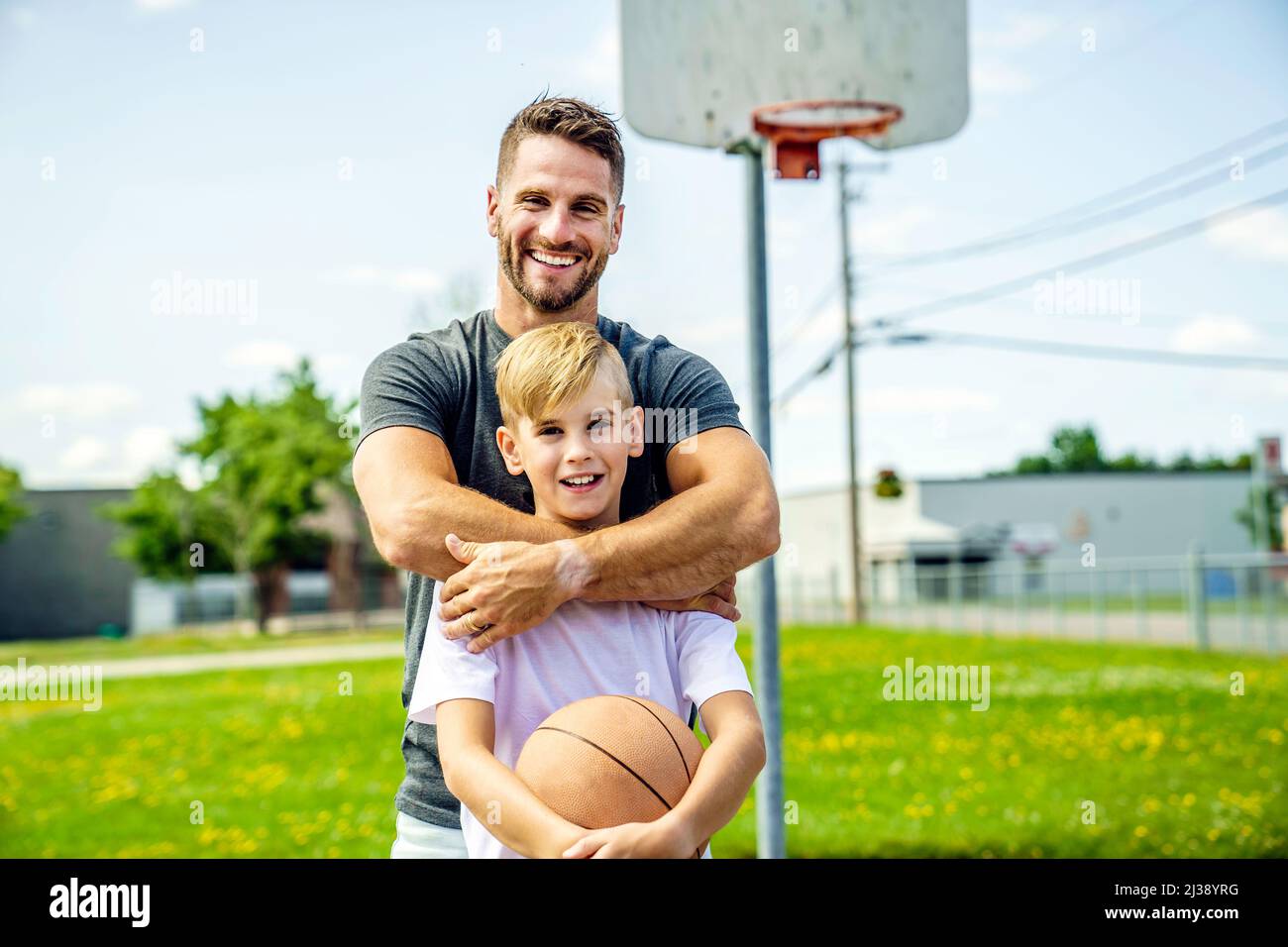Happy basketball family portrait play this sport on summer season. The ...